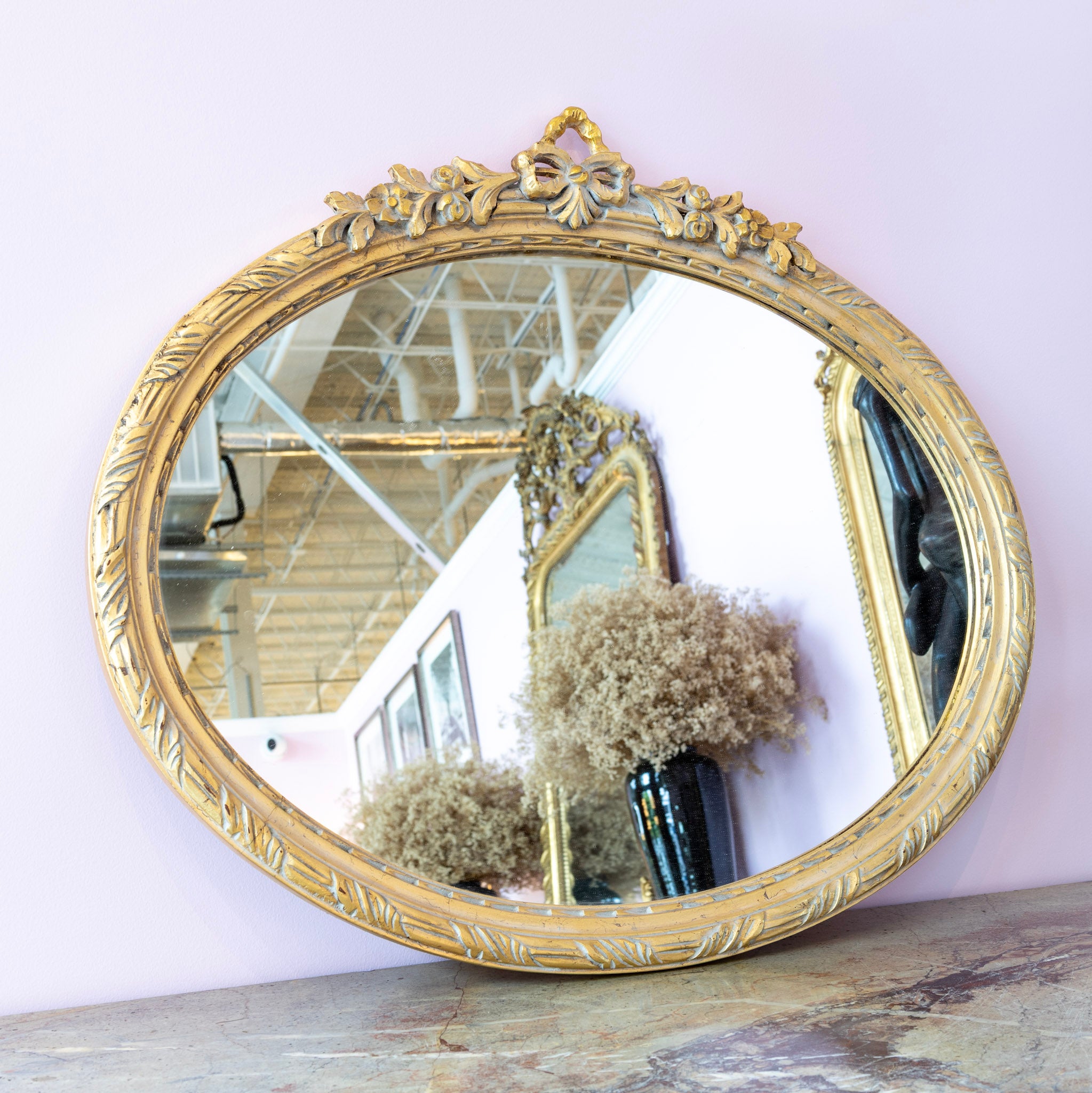 Louis XVI Round Gilded Mirror – Bow Carvings – Le Chateau